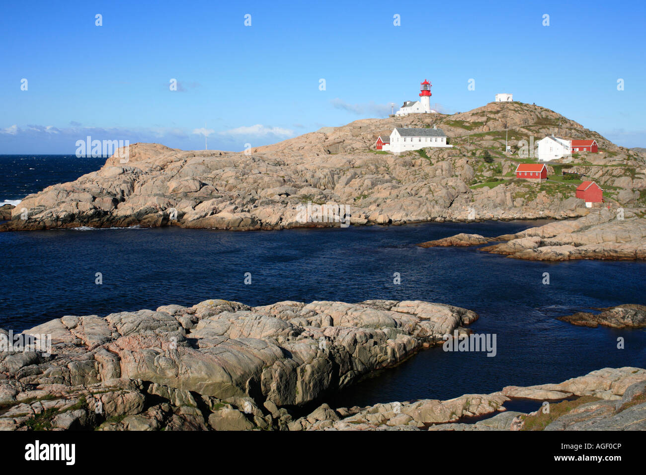 wooden houses and lighthouse at Lindesnes, the most southern point of ...