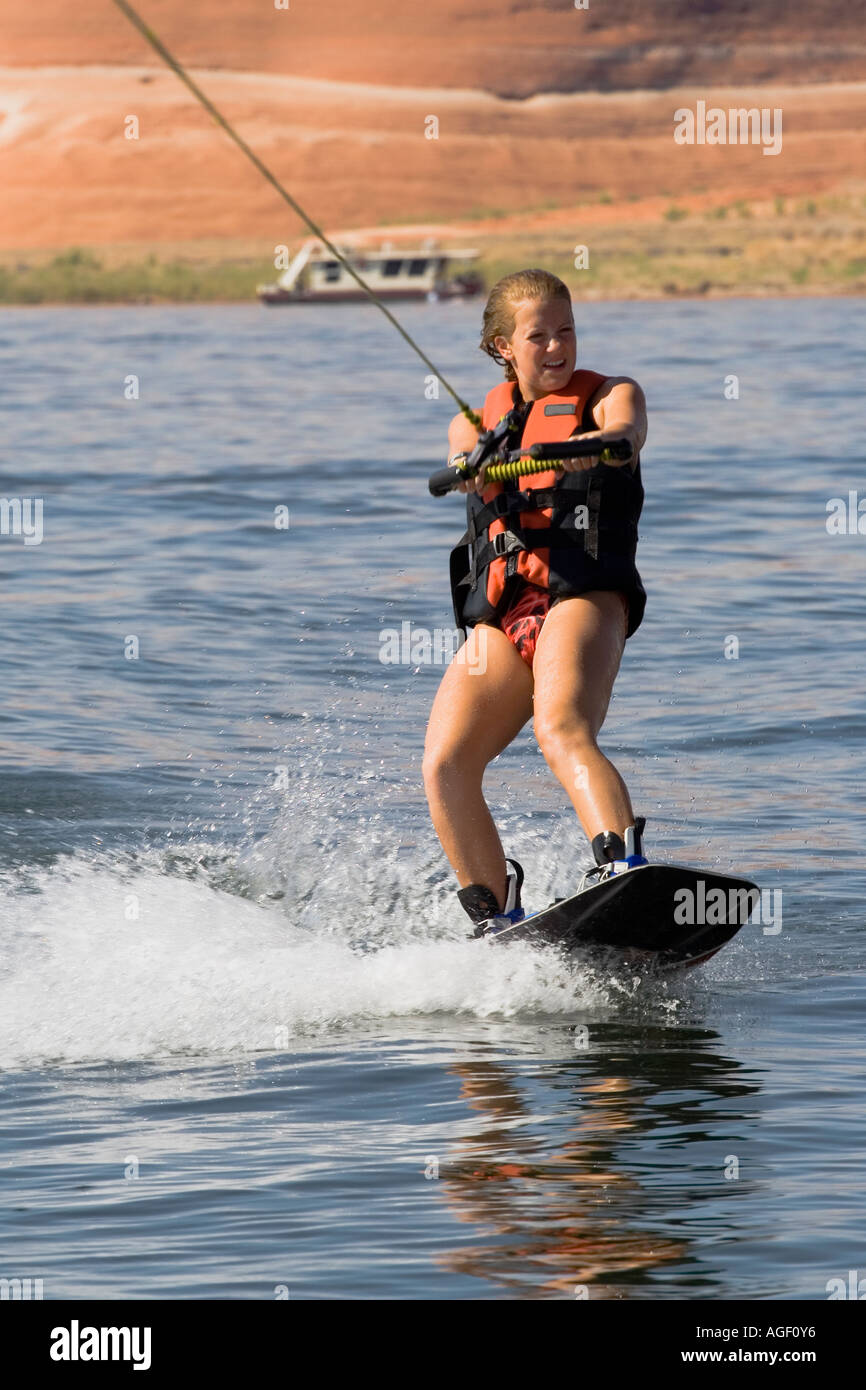 Girl wakeboarding at Lake Powell in Glen Canyon National Recreation ...