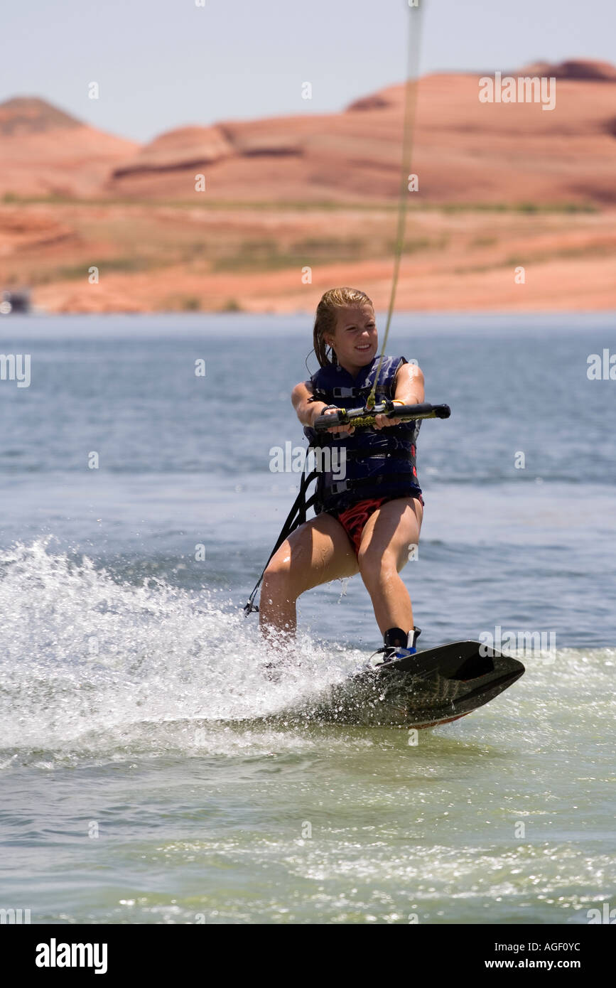 Girl wakeboarding at Lake Powell in Glen Canyon National Recreation ...