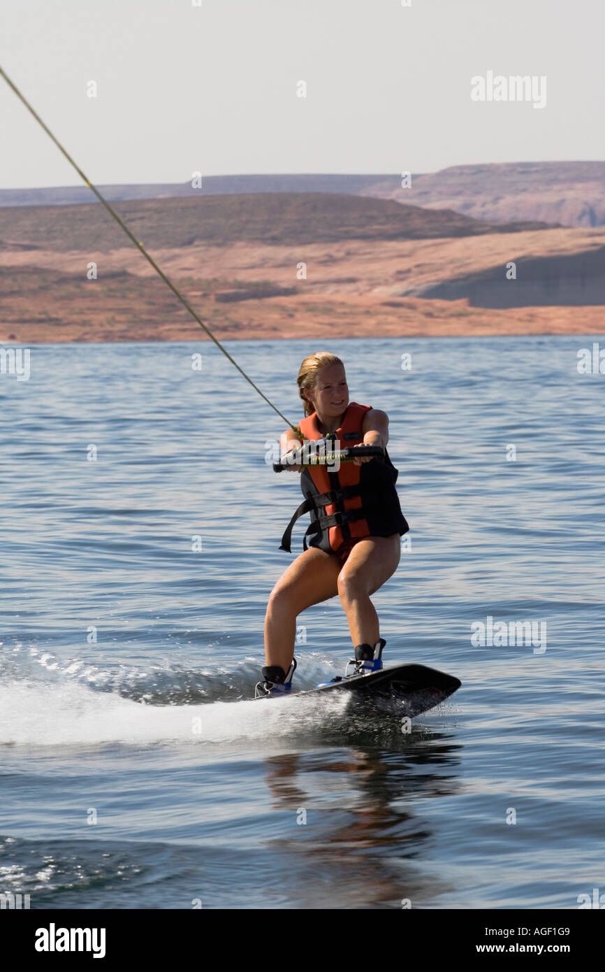 Girl wakeboarding at Lake Powell in Glen Canyon National Recreation ...