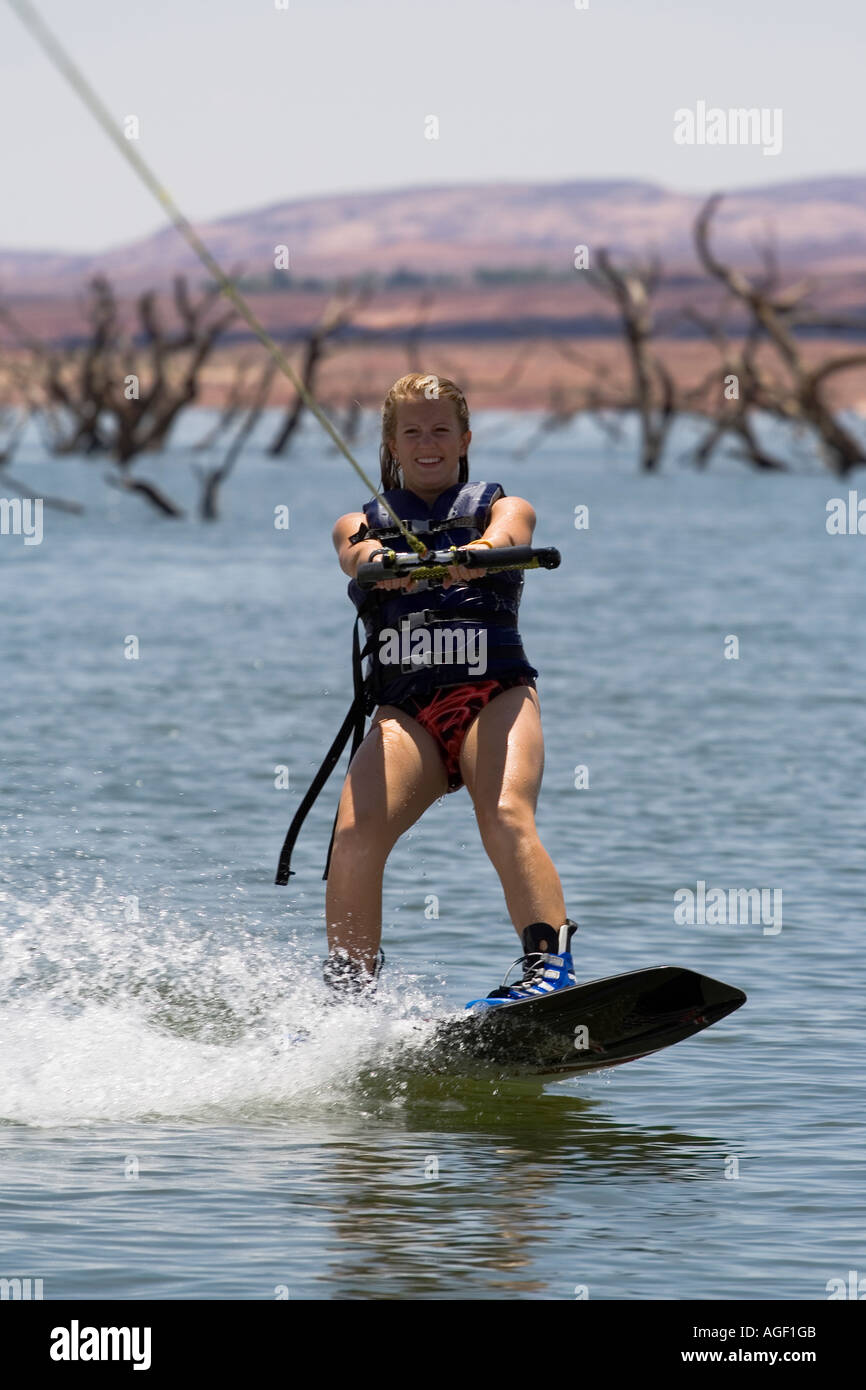 Girl wakeboarding at Lake Powell in Glen Canyon National Recreation ...