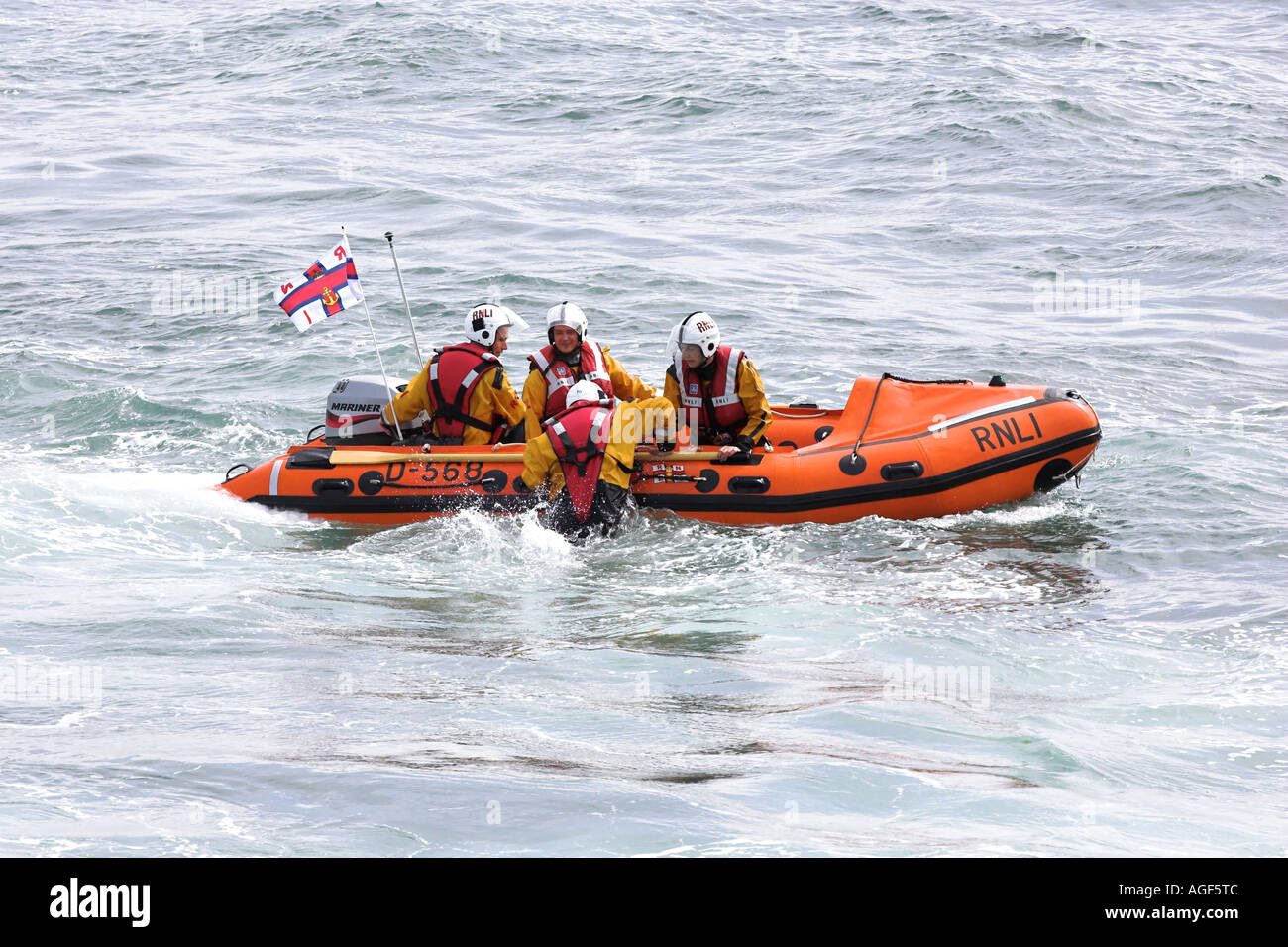 RNLI D series inshore lifeboat in action man over board excercise ...