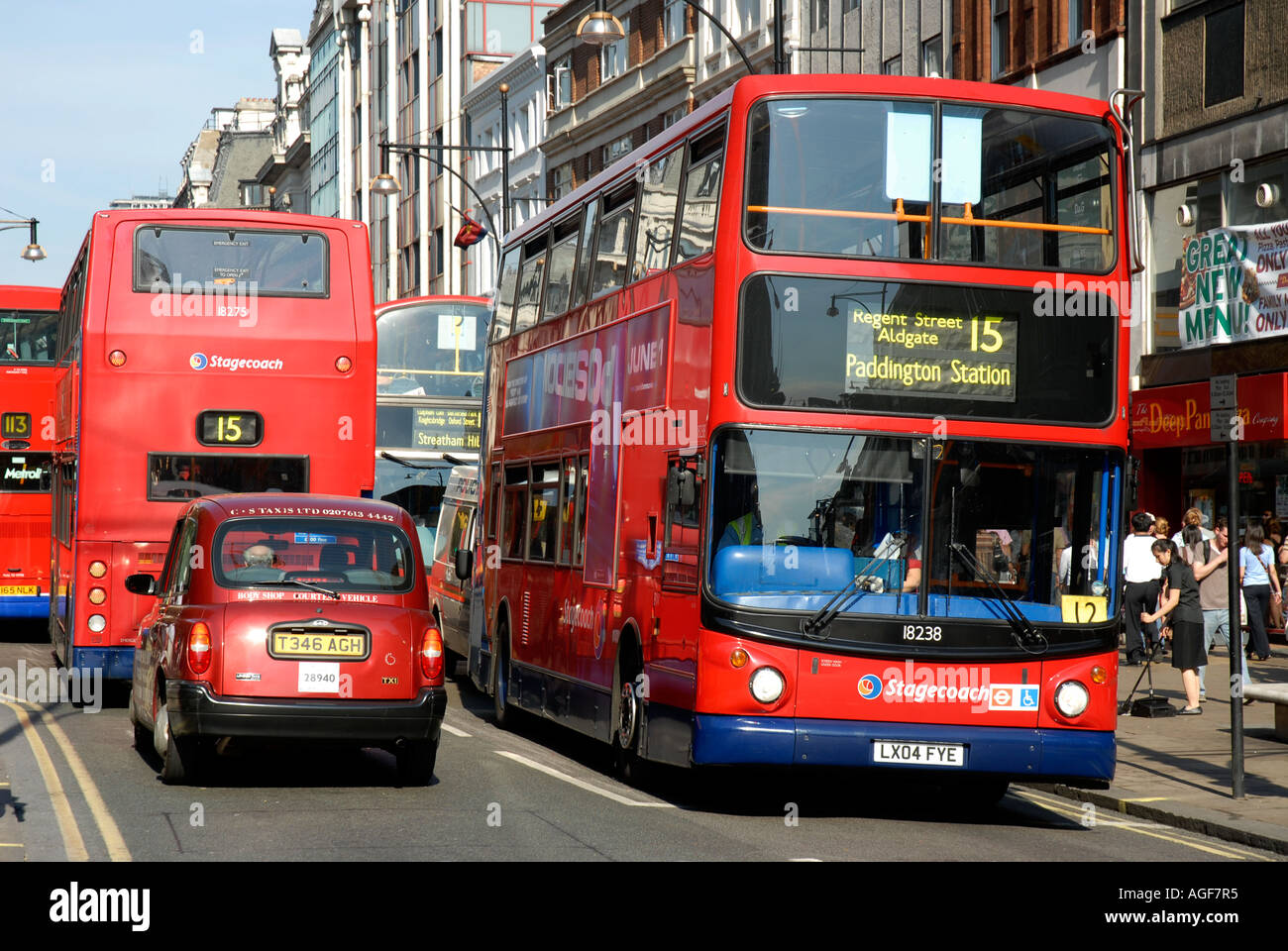 Red double decker buses in Oxford Street London Stock Photo - Alamy