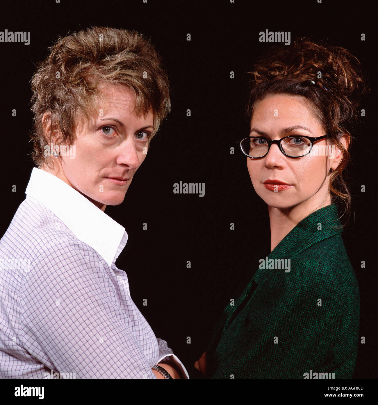Two serious women Stock Photo - Alamy