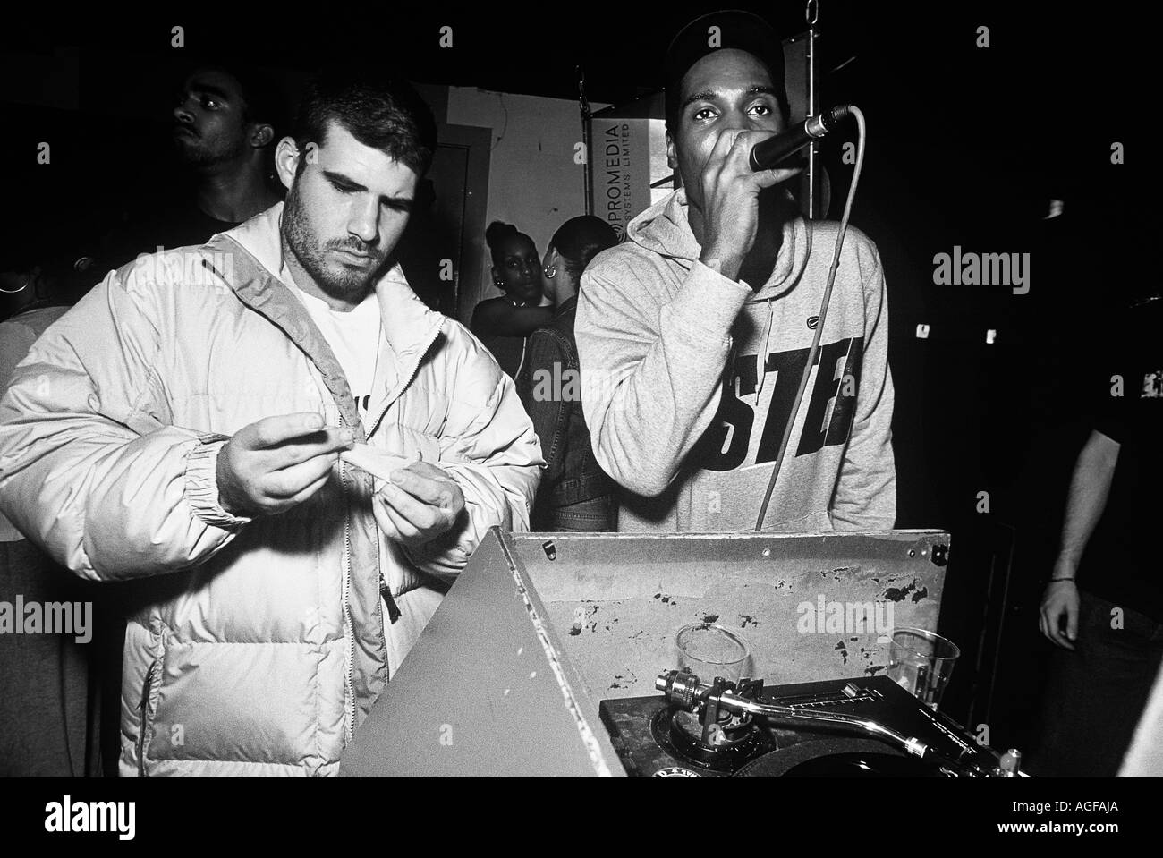 MC and guy rolling spliff at Forward Plastic People London Stock Photo ...