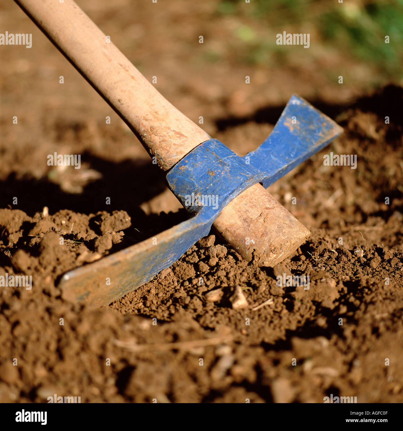 Pickaxe and soil Stock Photo - Alamy