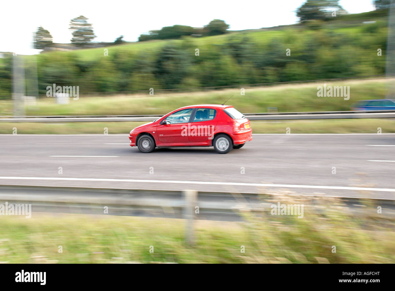red hot hatch on motorway Stock Photo - Alamy