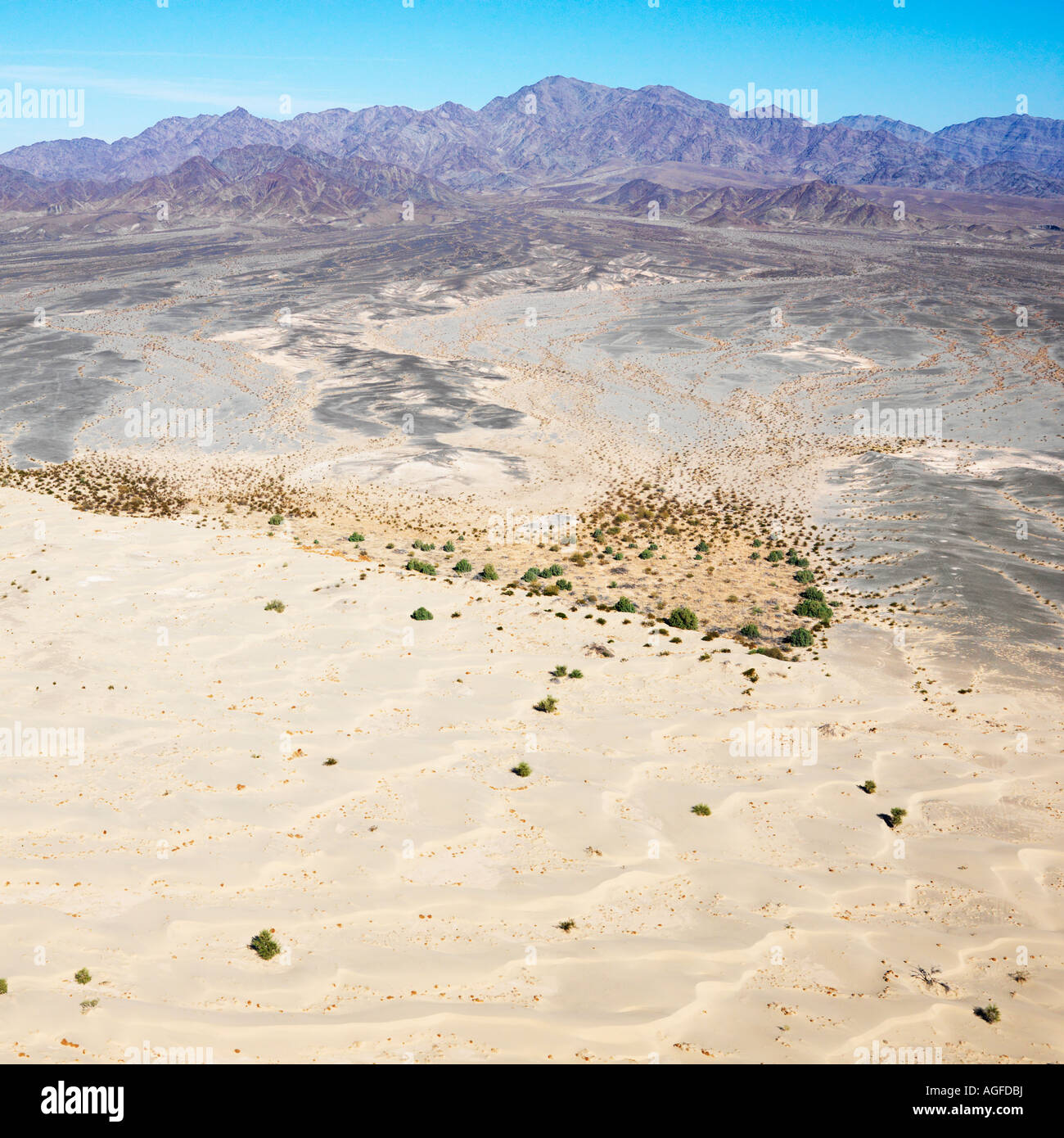 Aerial view of remote California desert with mountain range in ...