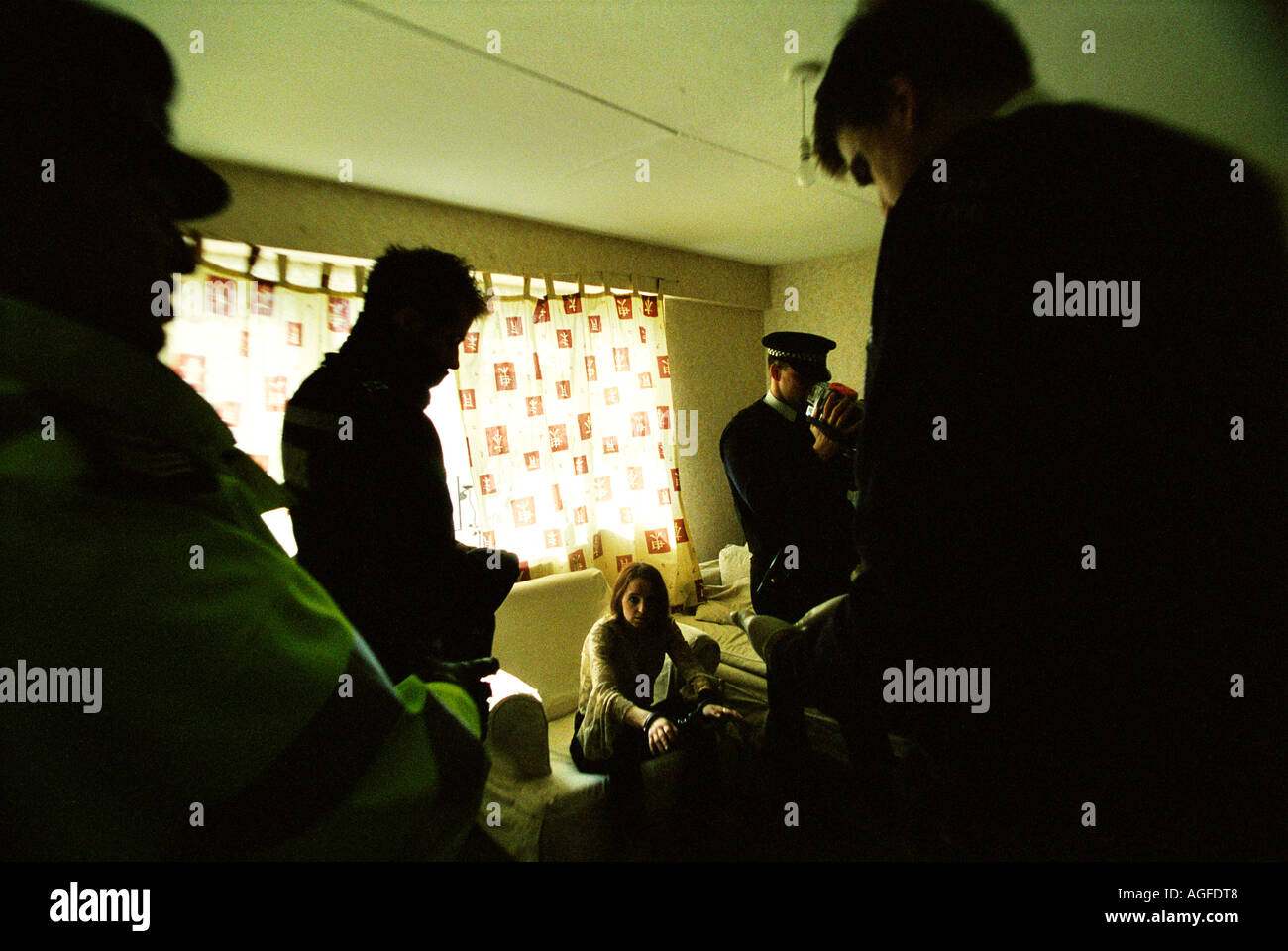 Policeman arresting woman hi-res stock photography and images - Alamy