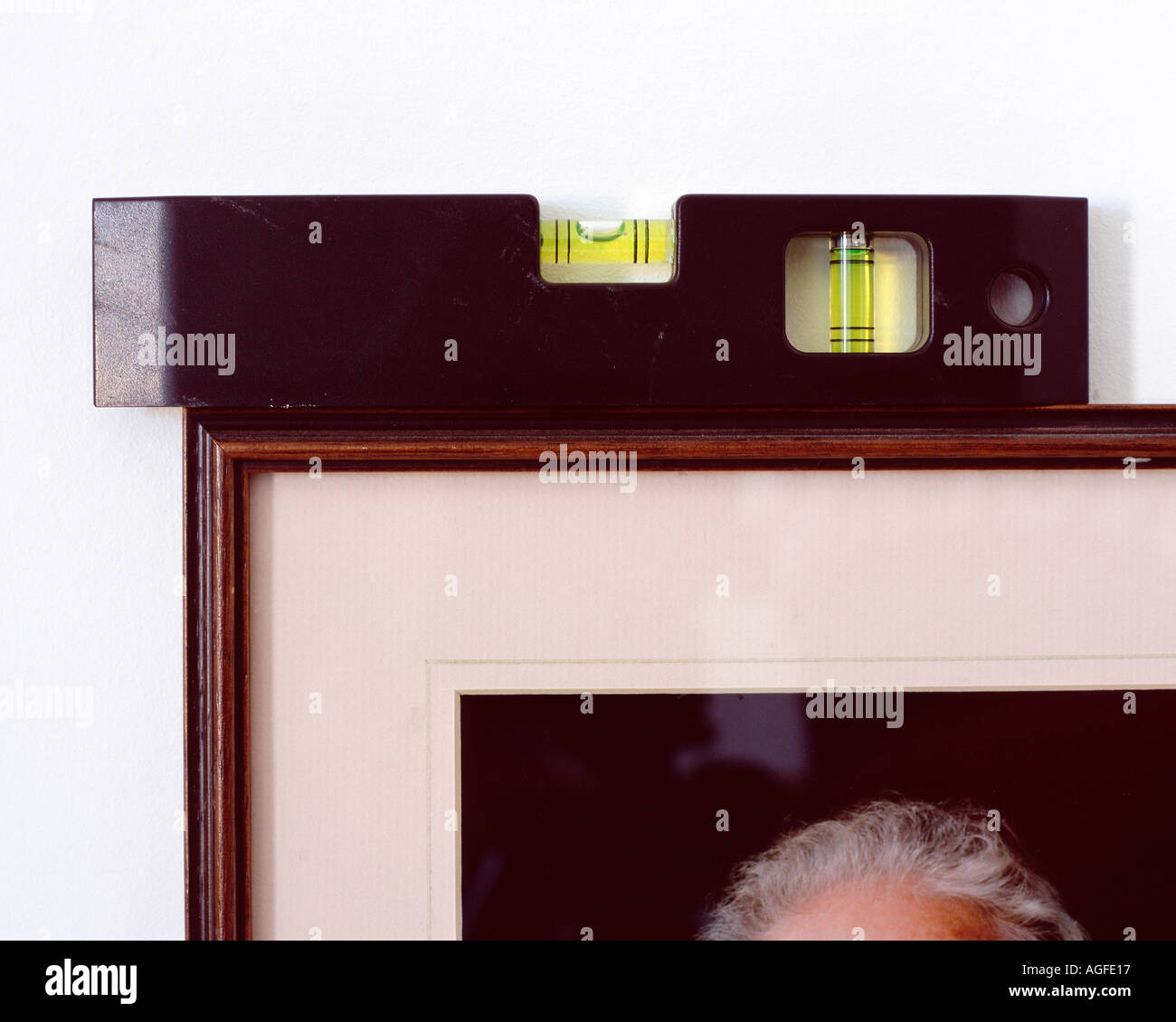 Spirit level on picture frame Stock Photo - Alamy