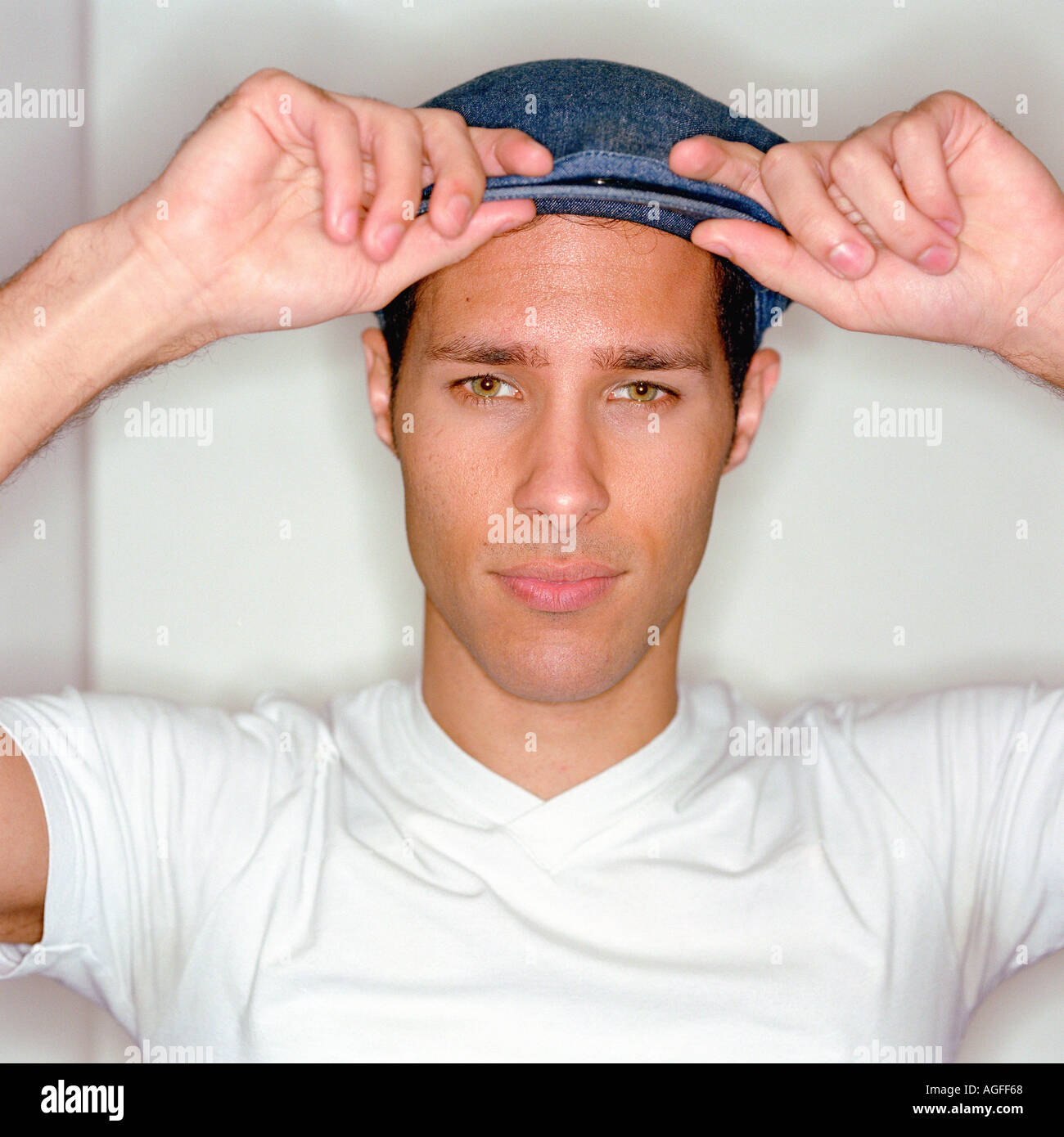 Wearing a cap hi-res stock photography and images - Alamy