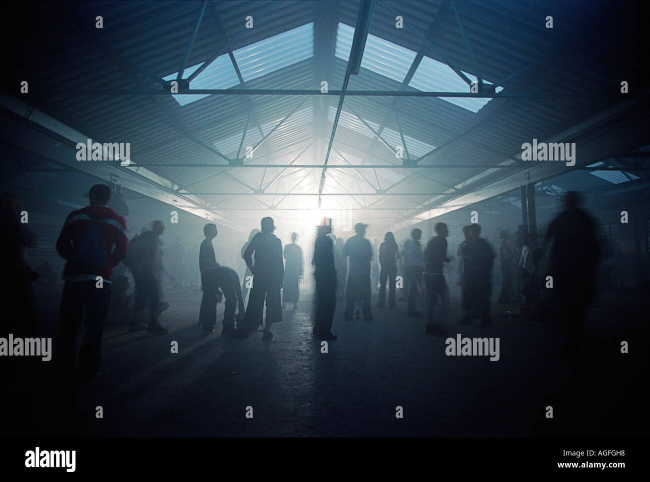 backlight photograph of illegal rave in warehouse Stock Photo - Alamy