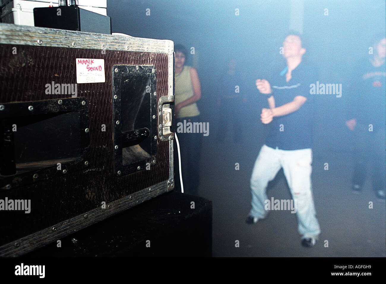 Man raving behind sound system Stock Photo - Alamy