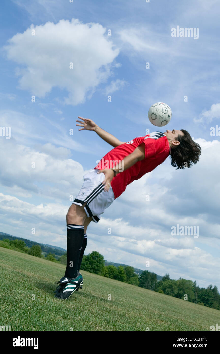 Latino male playing soccer hi-res stock photography and images - Alamy