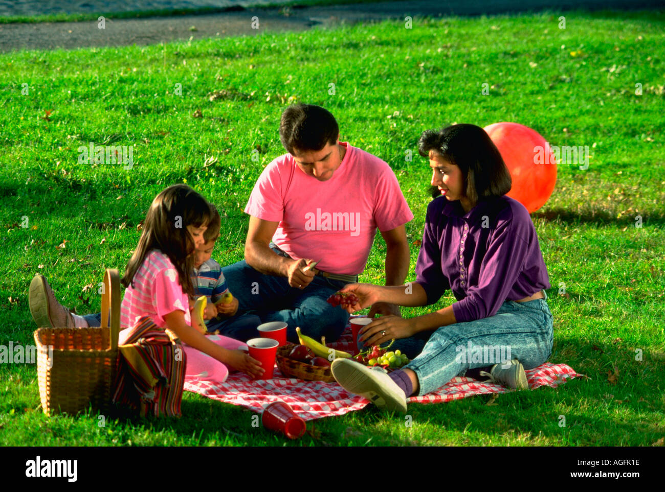 Young couple sharing picnic lunch hi-res stock photography and images ...