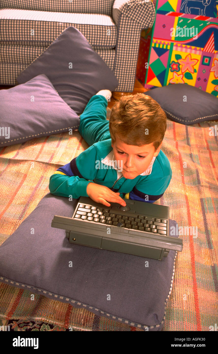 BOY WITH COMPUTER Stock Photo - Alamy