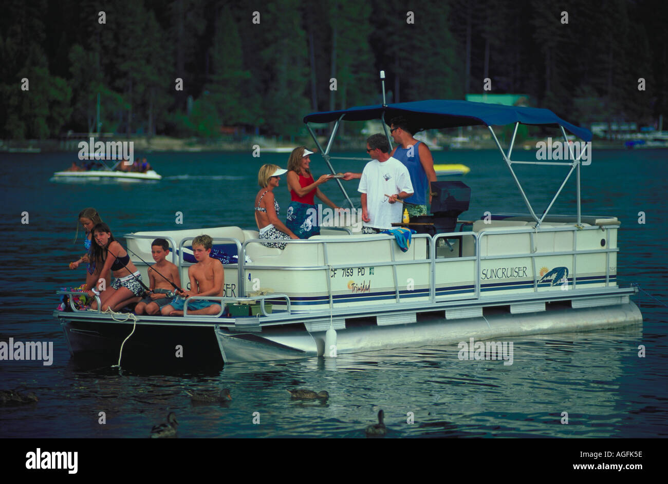 Two girls talking two boats hi-res stock photography and images - Alamy