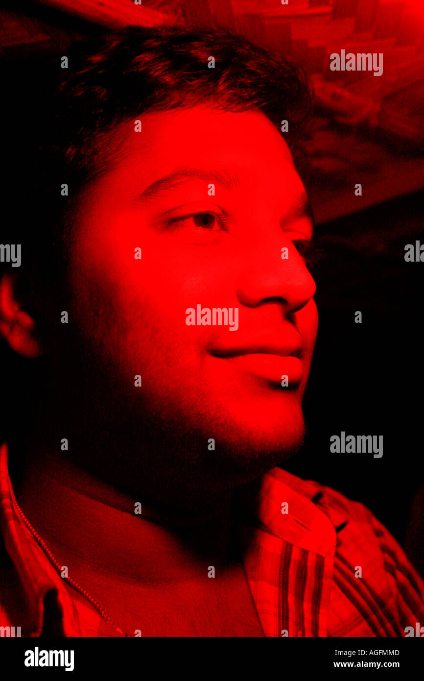 Close up of a man's face seen at a trance party Stock Photo - Alamy