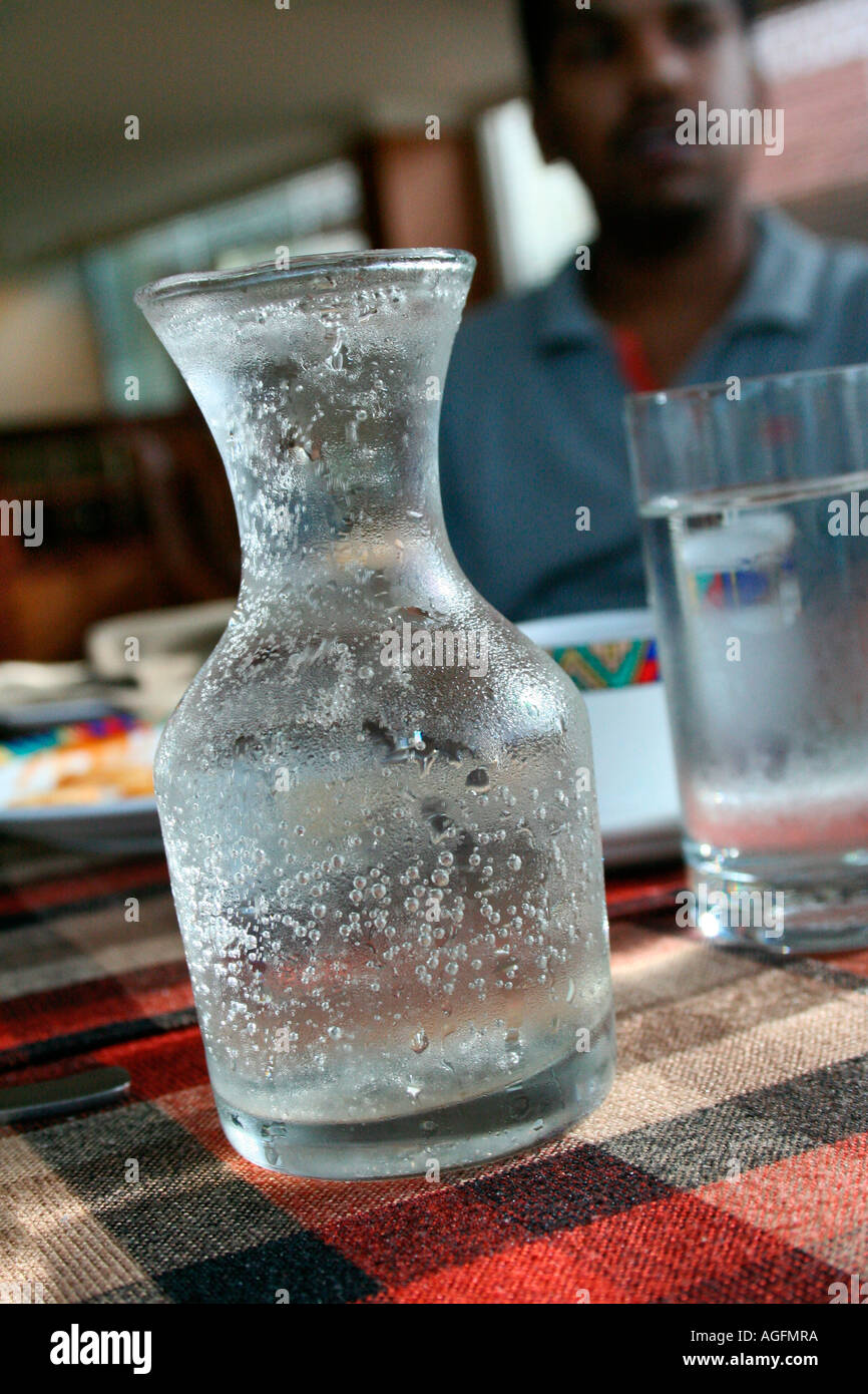 A bottle of effervescent soda placed on table Stock Photo - Alamy