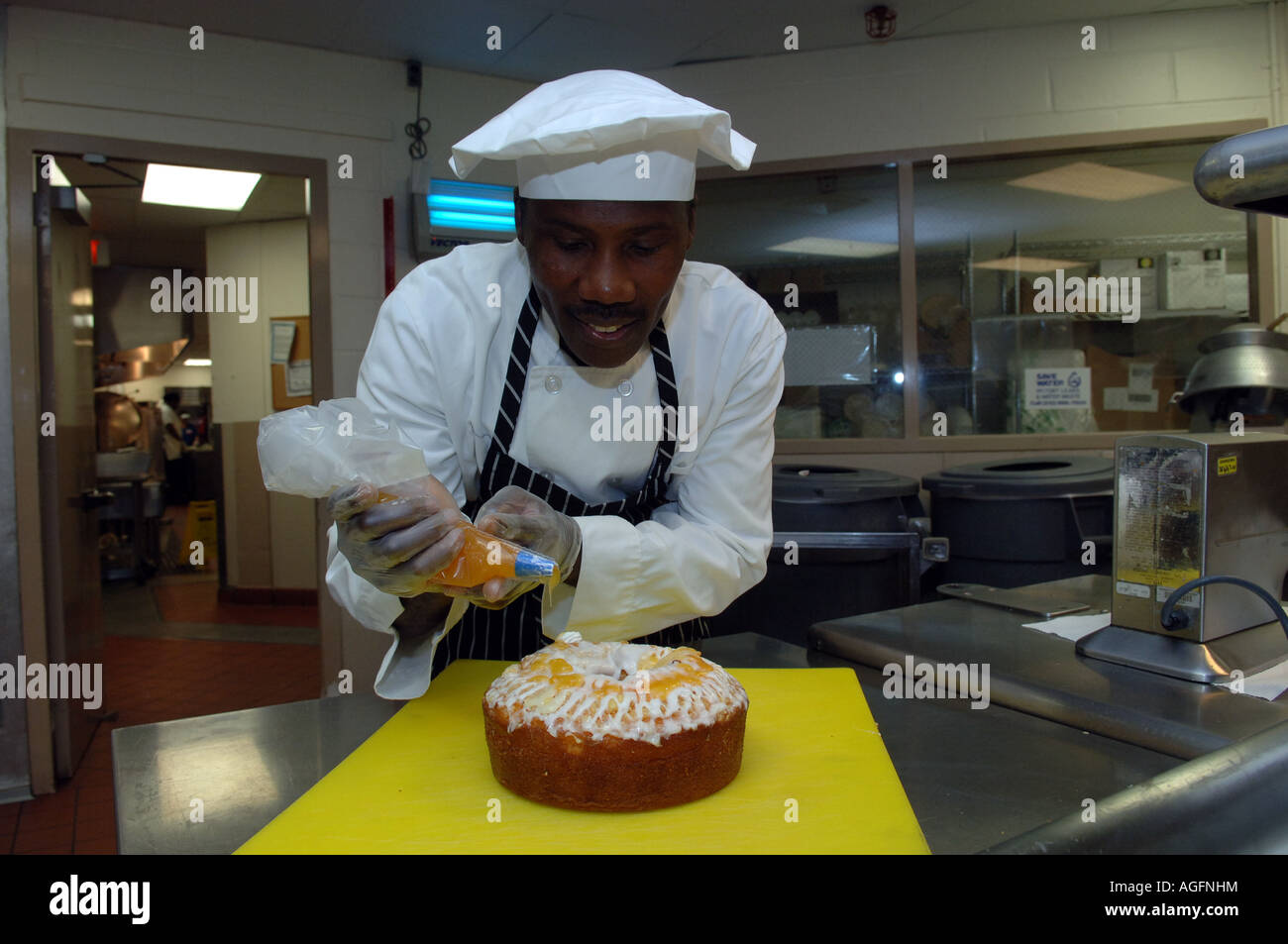 Male chef icing cake in hi-res stock photography and images - Alamy