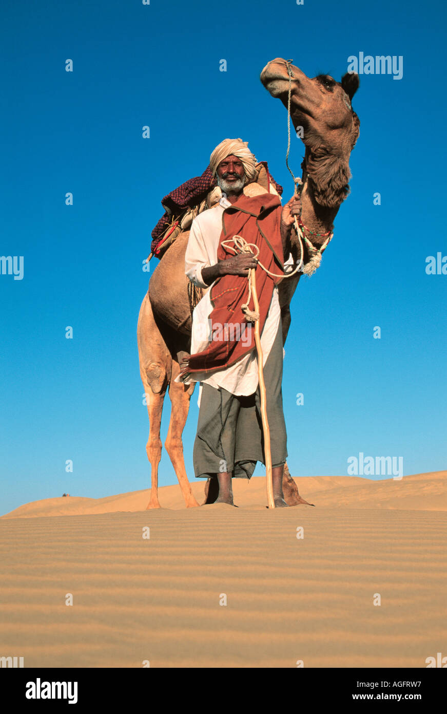 Camel with keeper, Sam desert, Rajasthan, India Stock Photo - Alamy