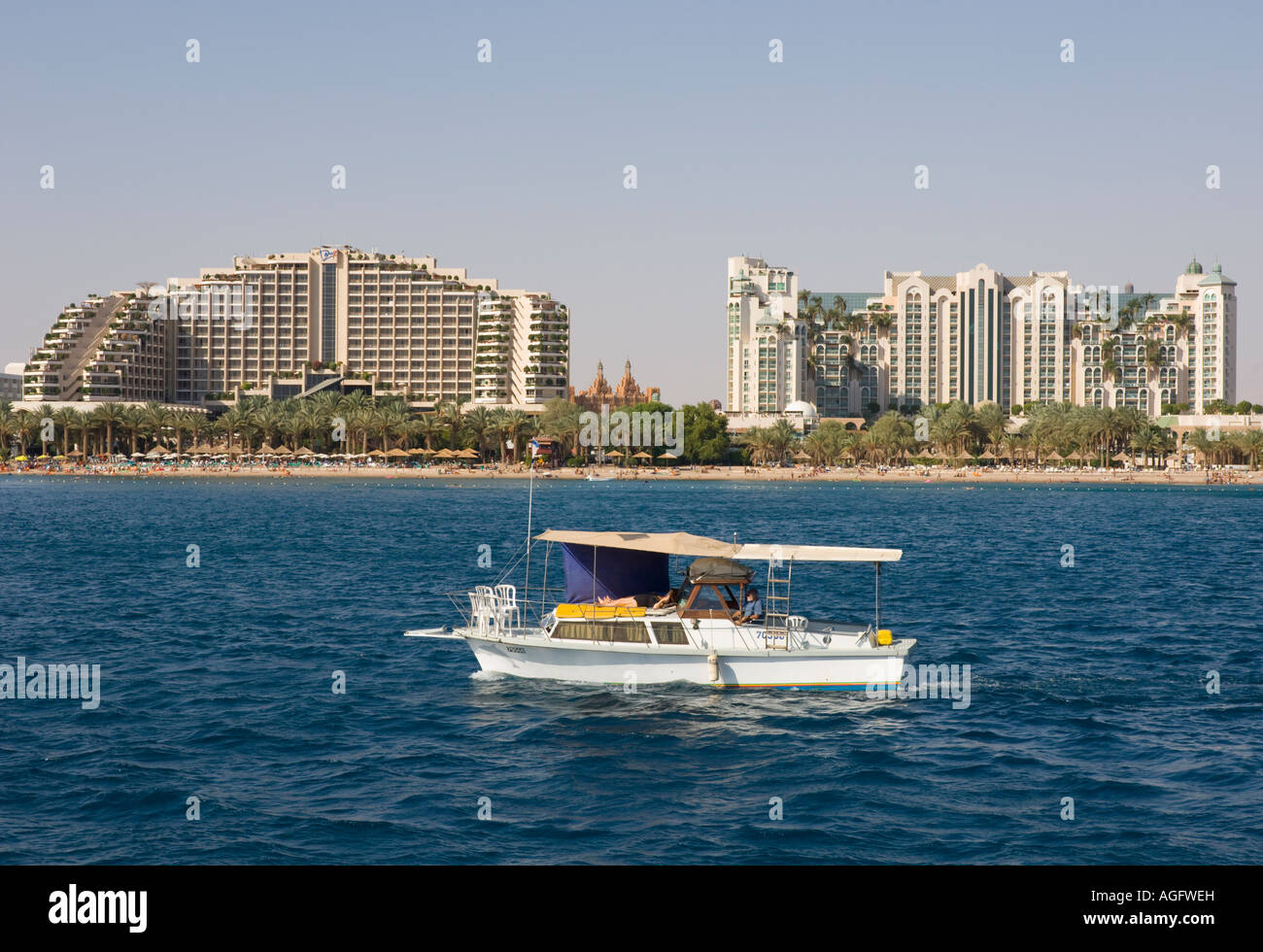 Israel Red Sea Eilat North Beach view from boat with boat in frgd and ...