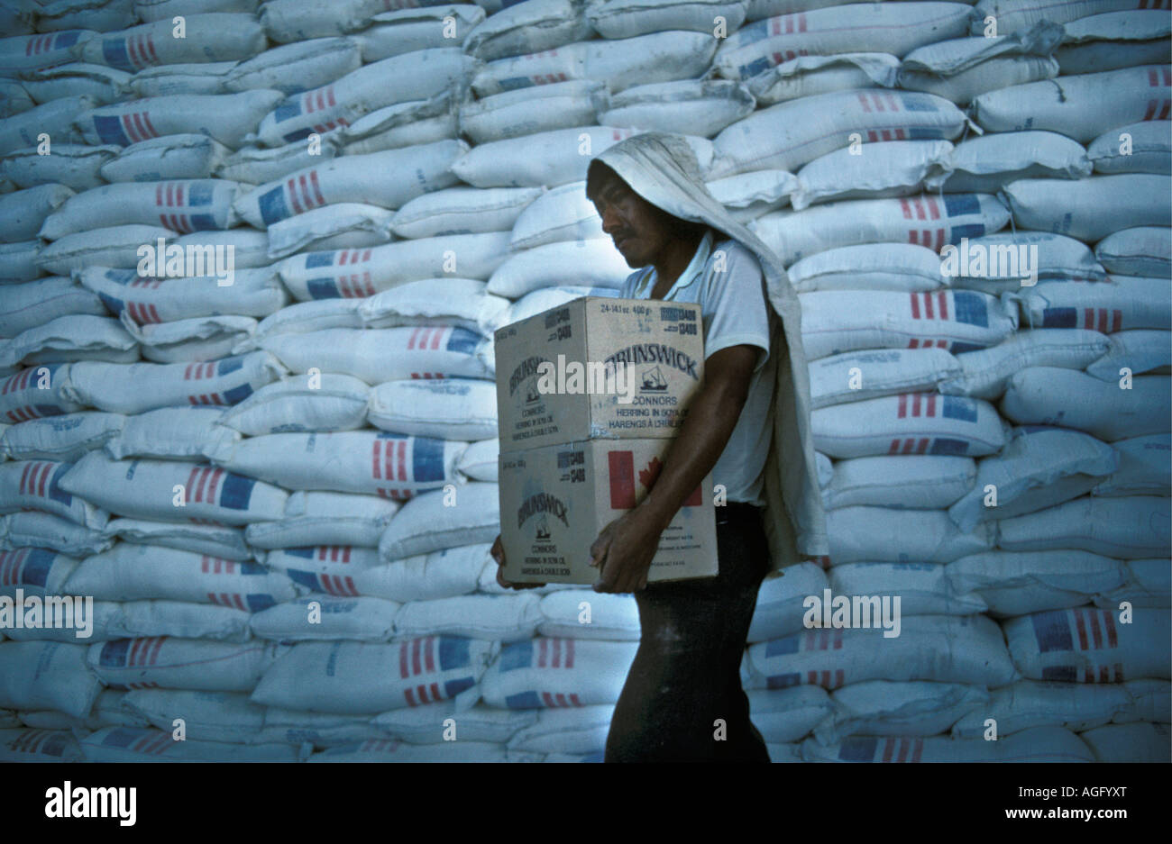 Bolivia Cochabamba Man carrying food aid from US government distributed ...