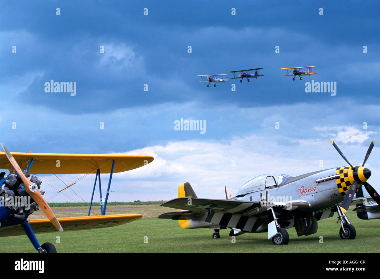 Biplane Fly-past With P25 Mustang Stock Photo - Alamy