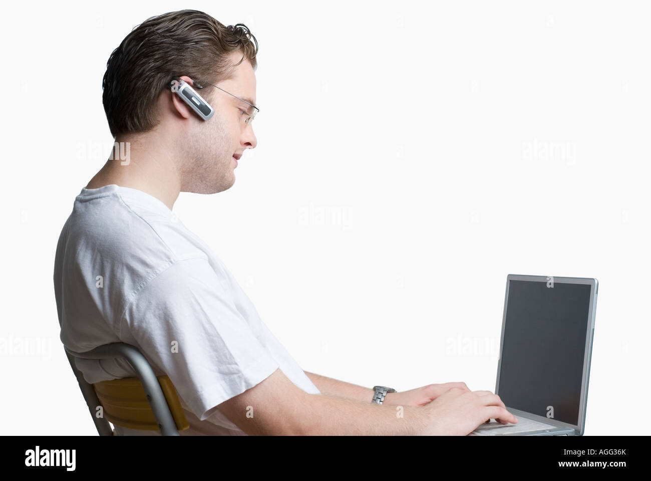 Side profile of a young man using a laptop Stock Photo - Alamy