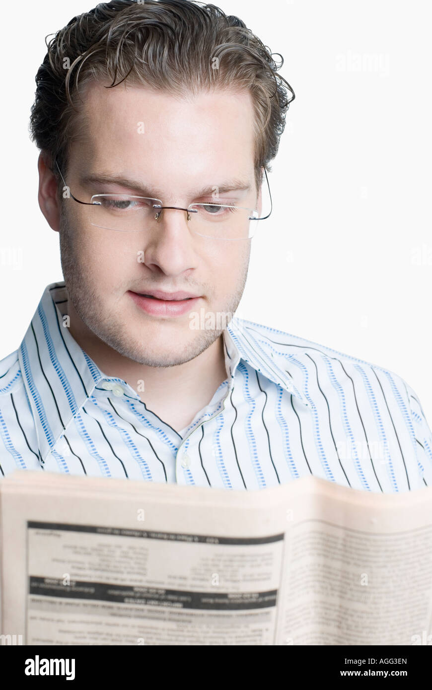 Person holding reading open newspaper hi-res stock photography and ...