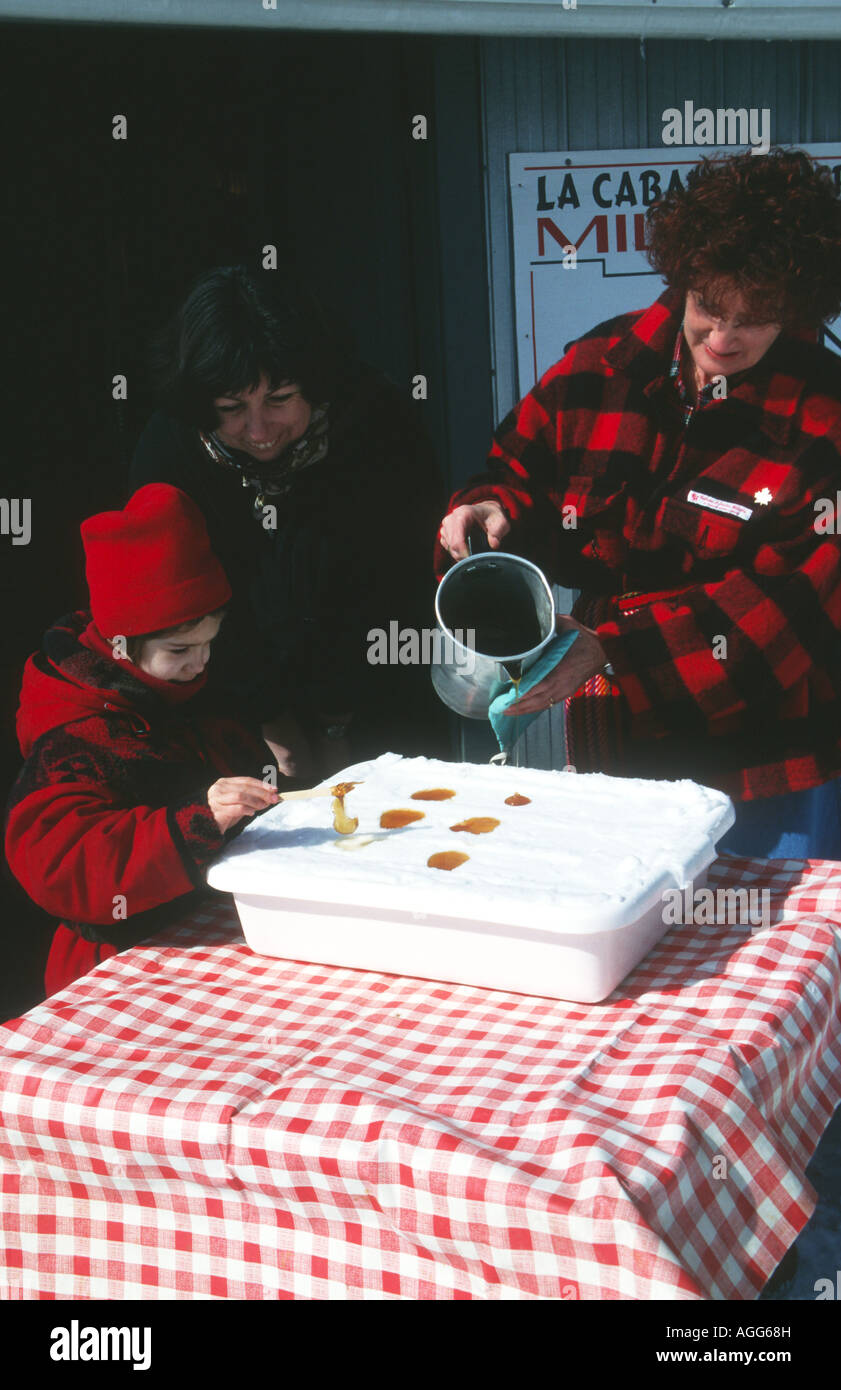 Child tasting maple sugar at a 'sugar shack' in the Rosemont Hills near ...