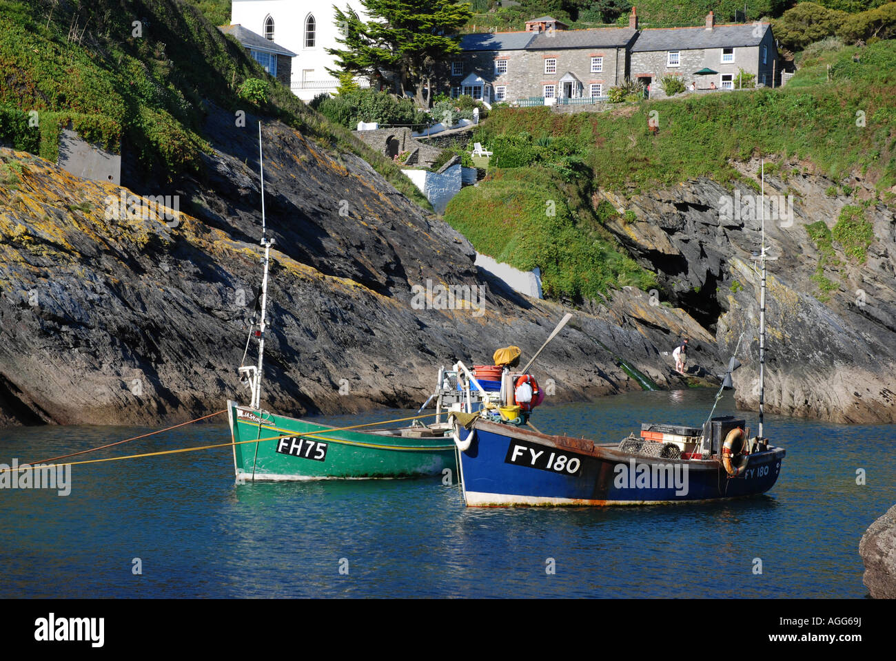 Two fishing boats floating in Portloe harbour Cornwall Stock Photo - Alamy