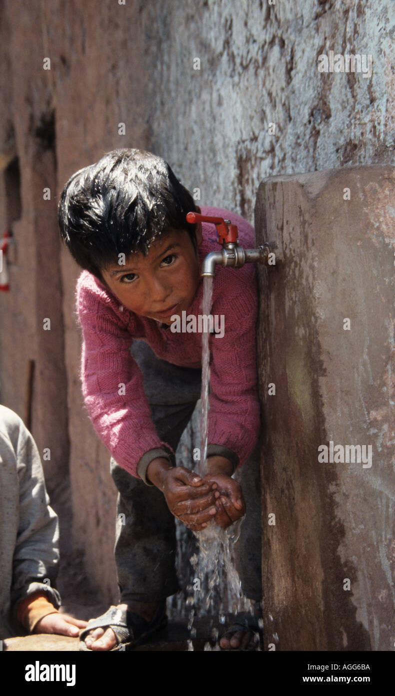 Peruvian boy washing hands Stock Photo - Alamy