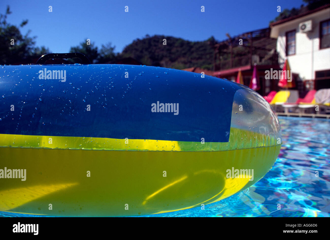 Bright blue and yellow rubber ring close up swimming pool Stock Photo ...