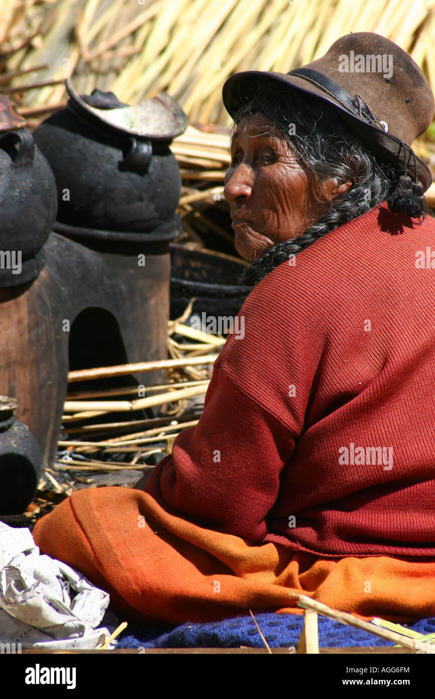 Elderly Peruvian lady cooking on Uros Floating Reed Islands Stock Photo ...
