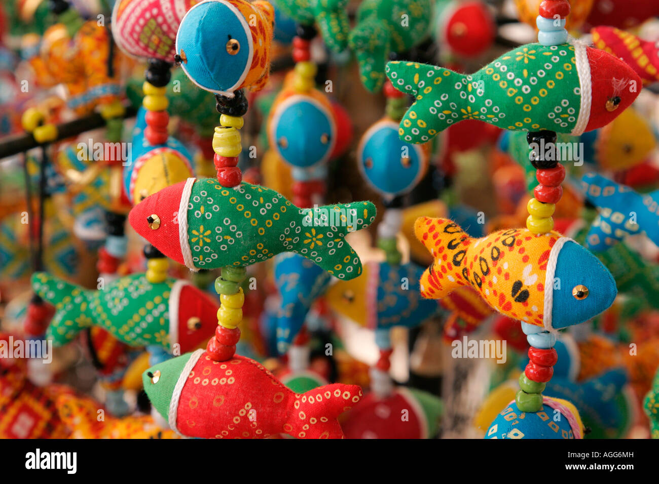 wooden fish toy tourist attraction souvenir red green blue detail close ...