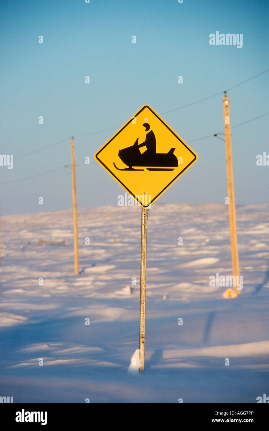 Snowy landscape with snowmobile crossing sign Stock Photo - Alamy