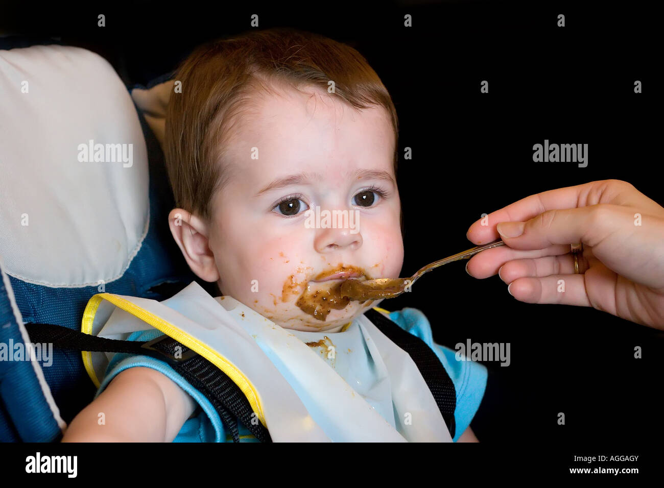 Baby being fed Stock Photo - Alamy