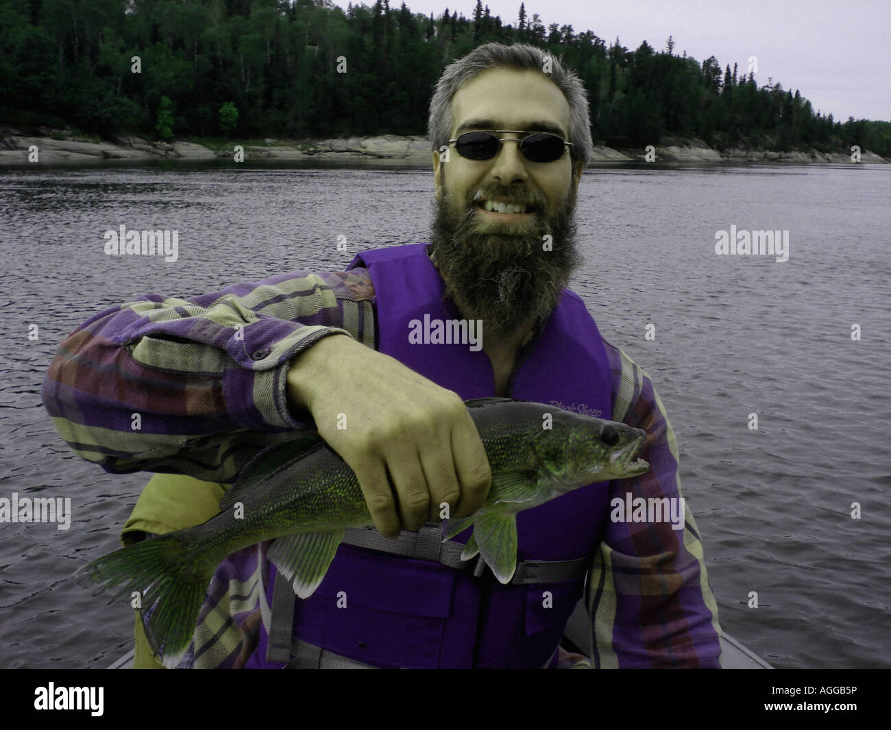 A Walleye fisherman with his catch Stock Photo - Alamy