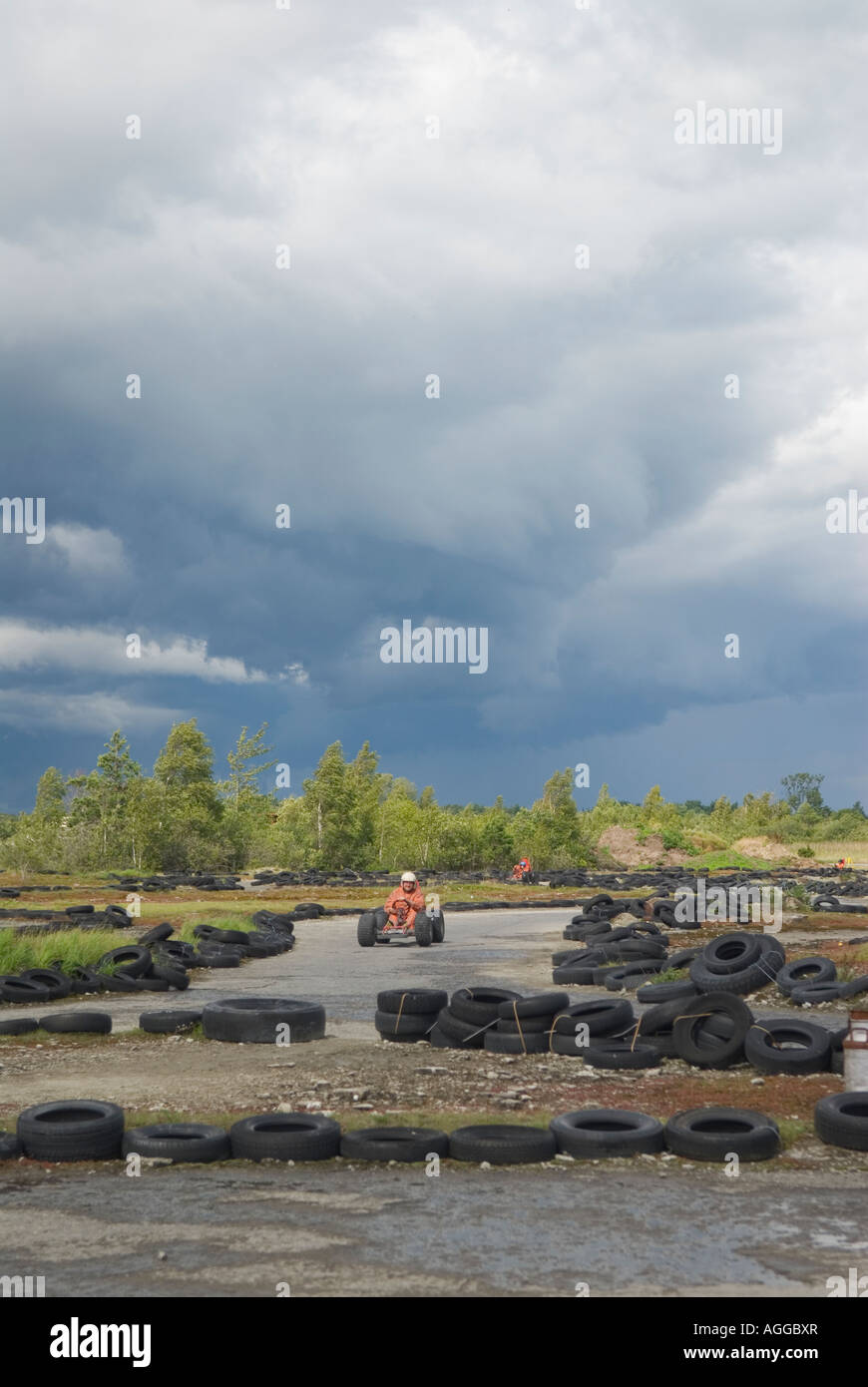 Cross cart driving on track Stock Photo - Alamy