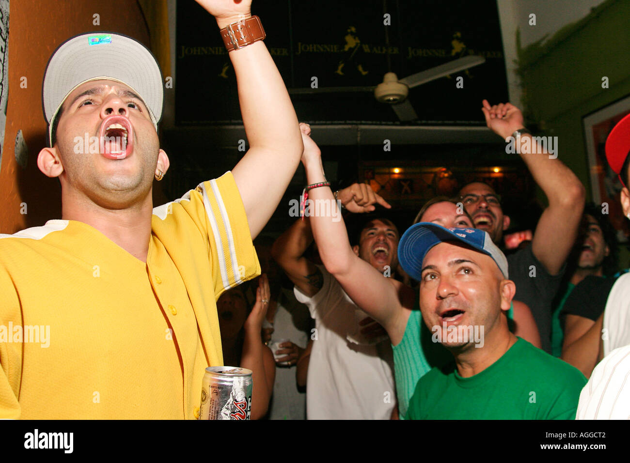 Crowd watching fight on TV in a bar in Old San Juan Puerto Rico Stock ...