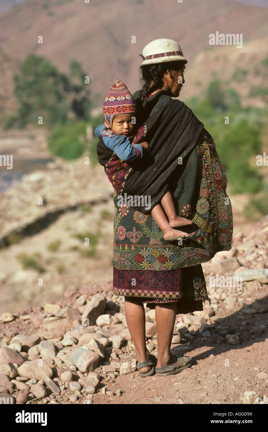 Bolivia Potolo Woman standing with child Stock Photo - Alamy