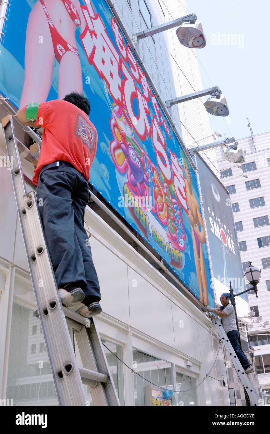 putting up a billboard, Tokyo, Japan Stock Photo - Alamy