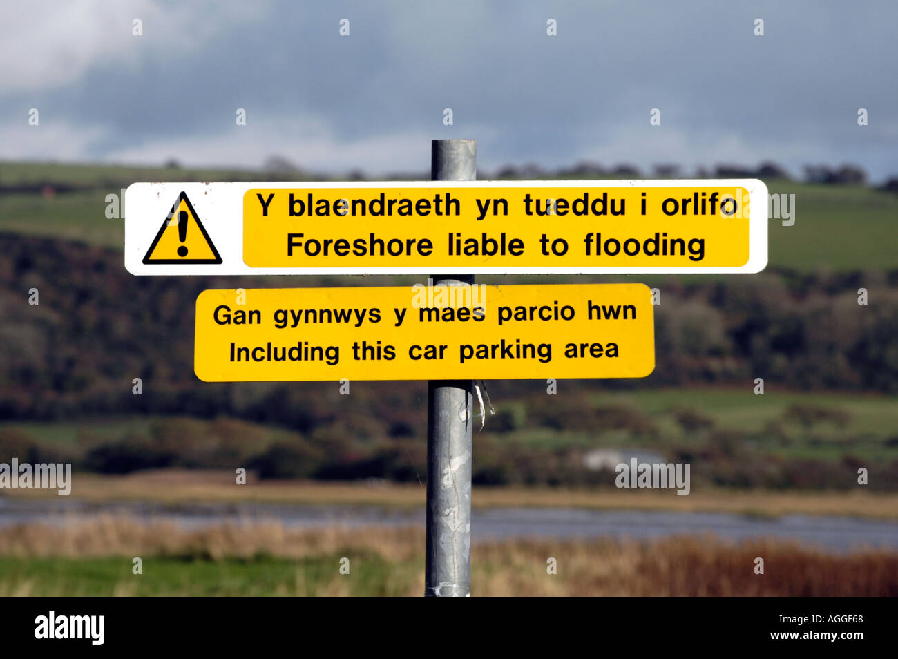 Bilingual Welsh English language sign warning of flooding on the ...