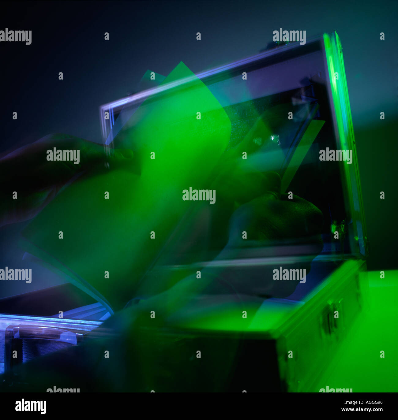 Handling papers from a briefcase Stock Photo - Alamy