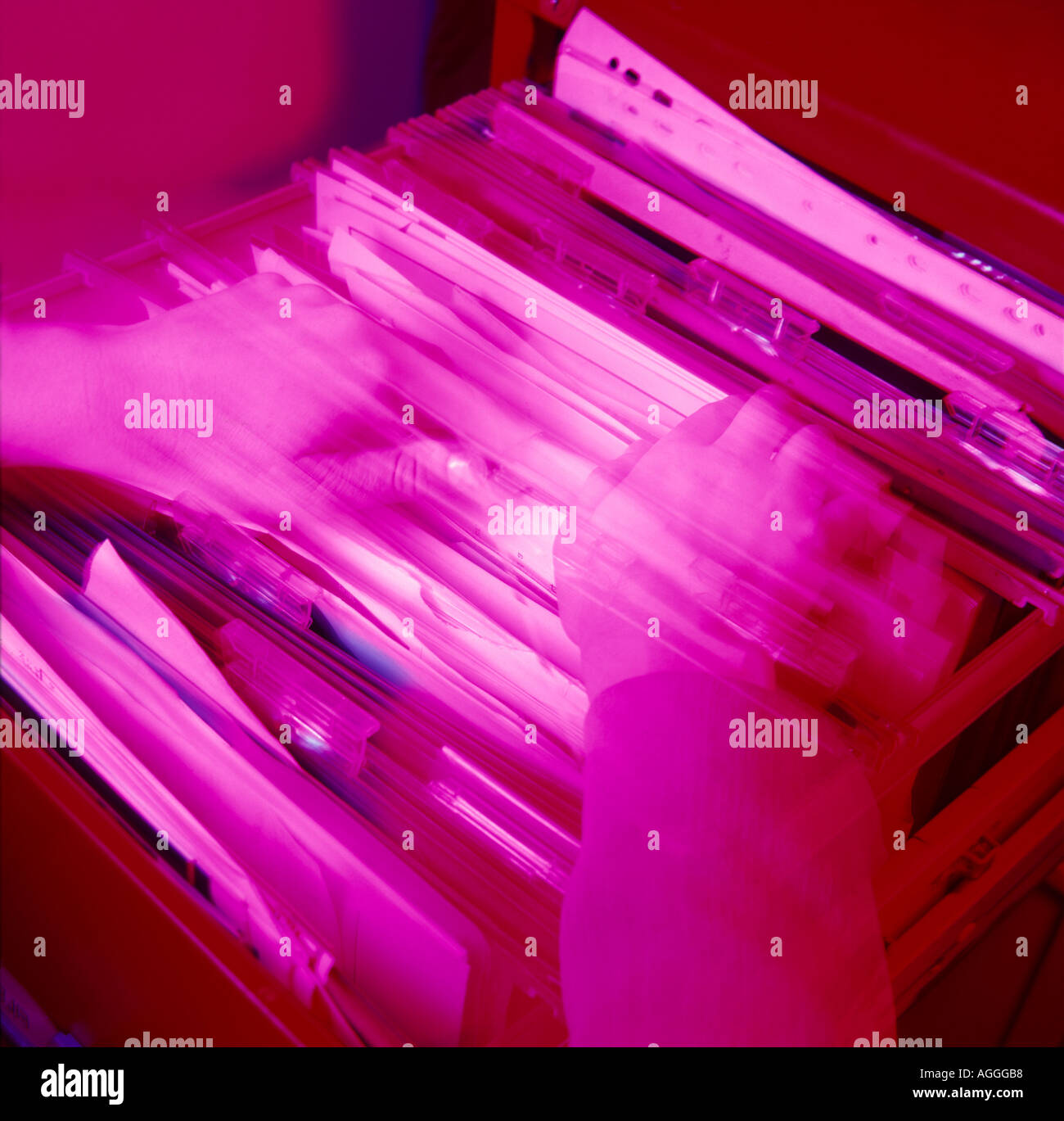 Hands rifling through files in filing cabinet Stock Photo - Alamy
