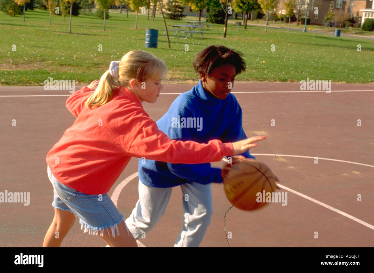 Friends age 13 playing basketball at Dunning Field. St Paul Minnesota ...