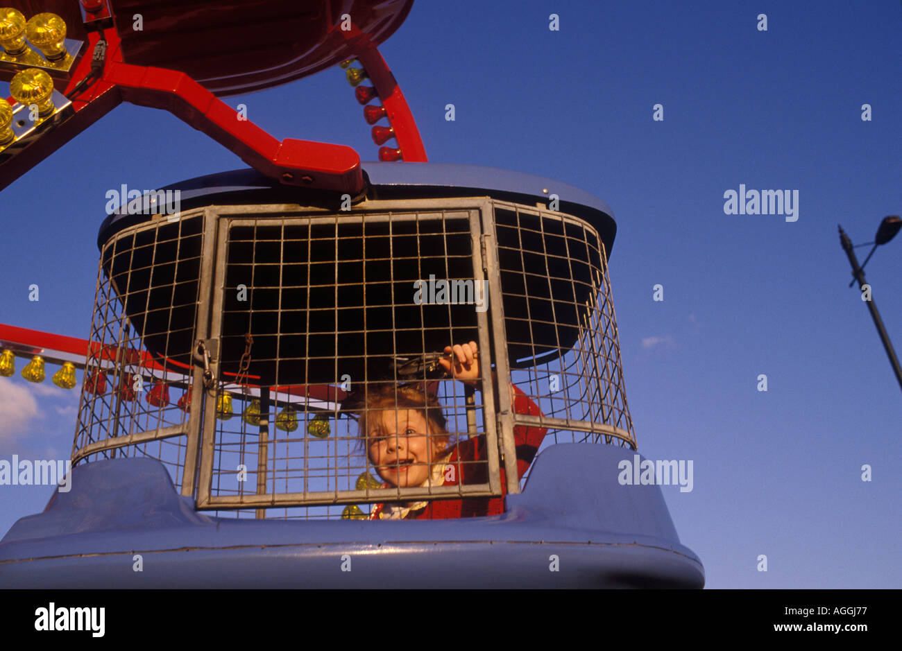 Young girl fun fair fairground ride child looking scared afraid of the ...
