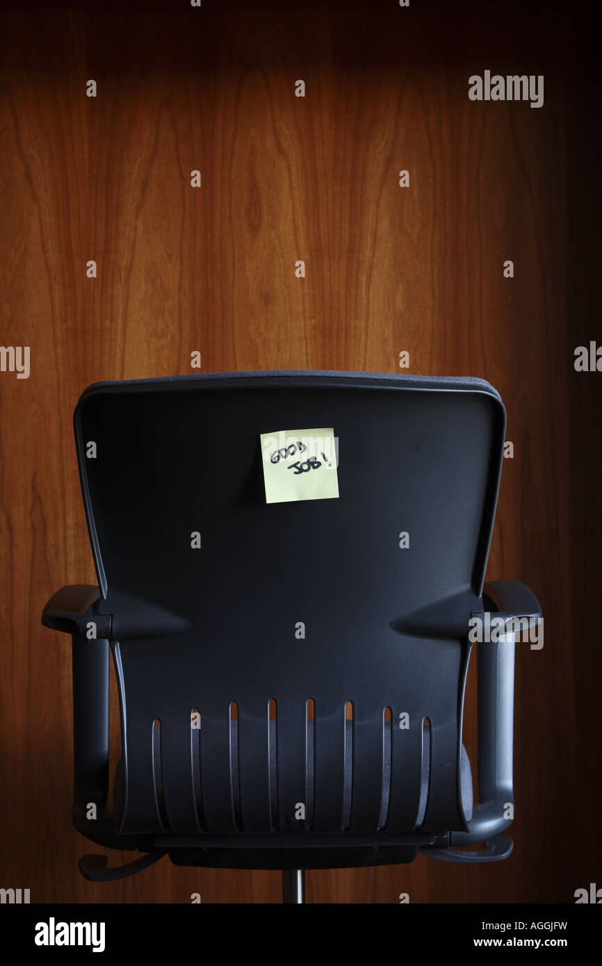 good job written on a post it note sticked on a armchair in an office ...