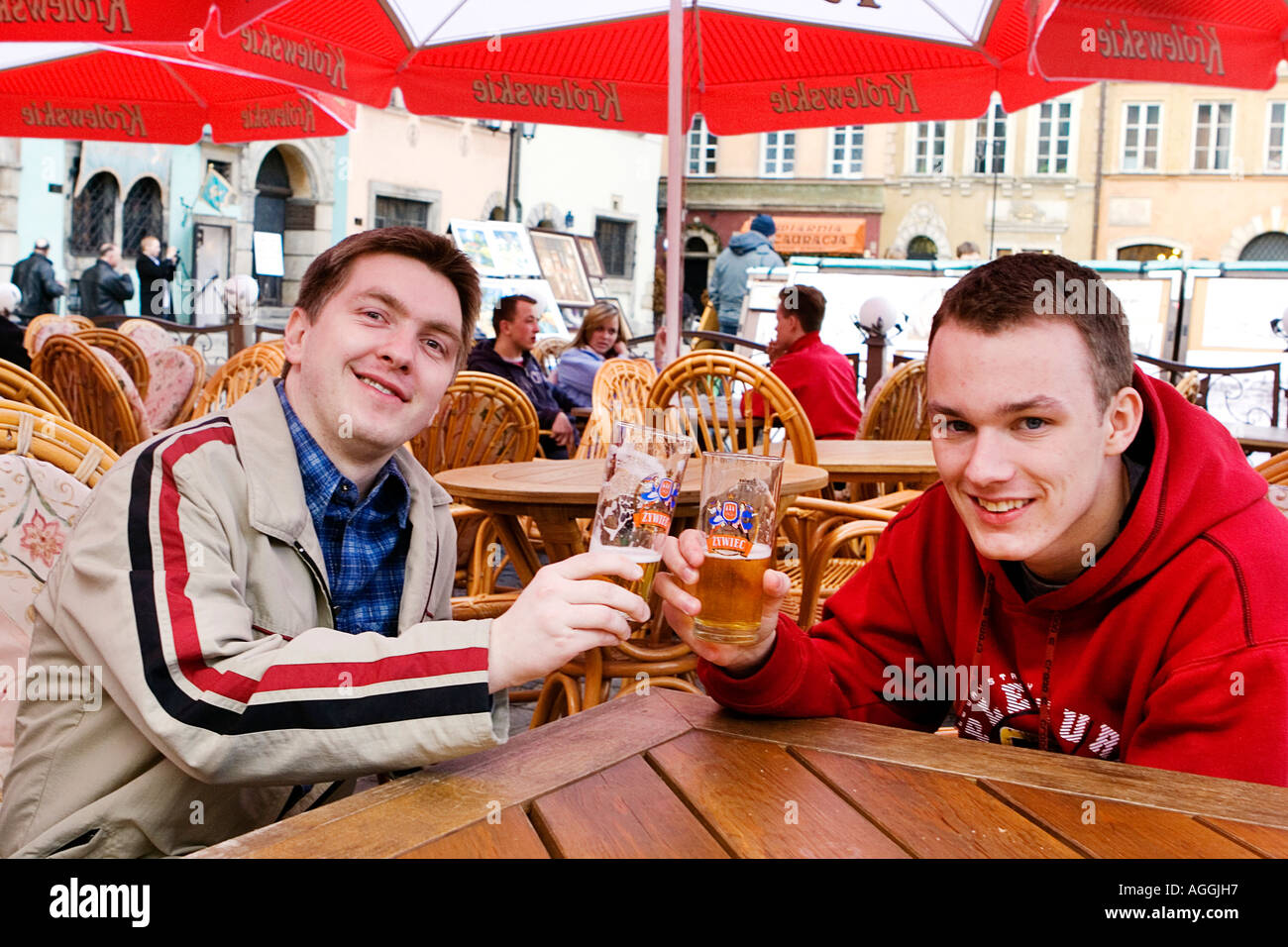 Two mates having a beer in the Old Market Square Warsaw Stock Photo - Alamy